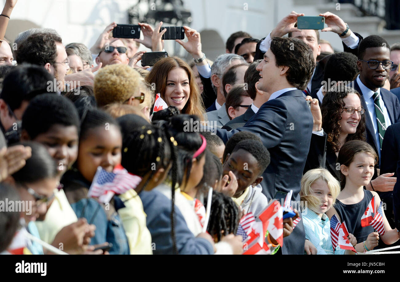 Prime Minister Justin Trudeau of Canada shakes hands with guests during ...