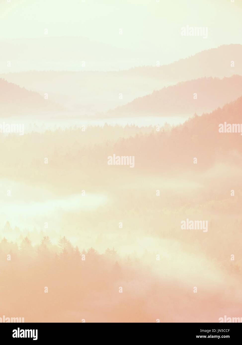 Red daybreak. Misty daybreak in a beautiful hills. Peaks of hills are ...