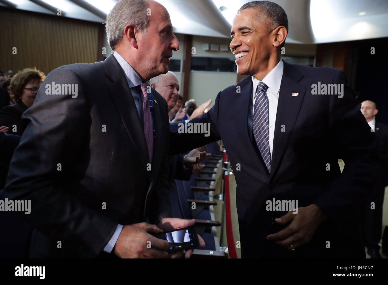 United States President Barack Obama (R) greets State Department staff ...