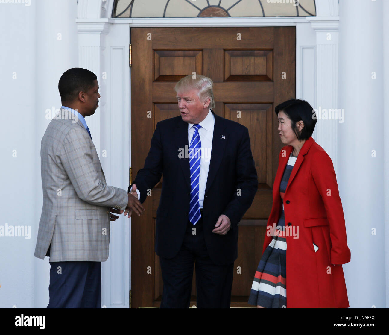 United States President-elect Donald Trump (C) greets Mayor of ...