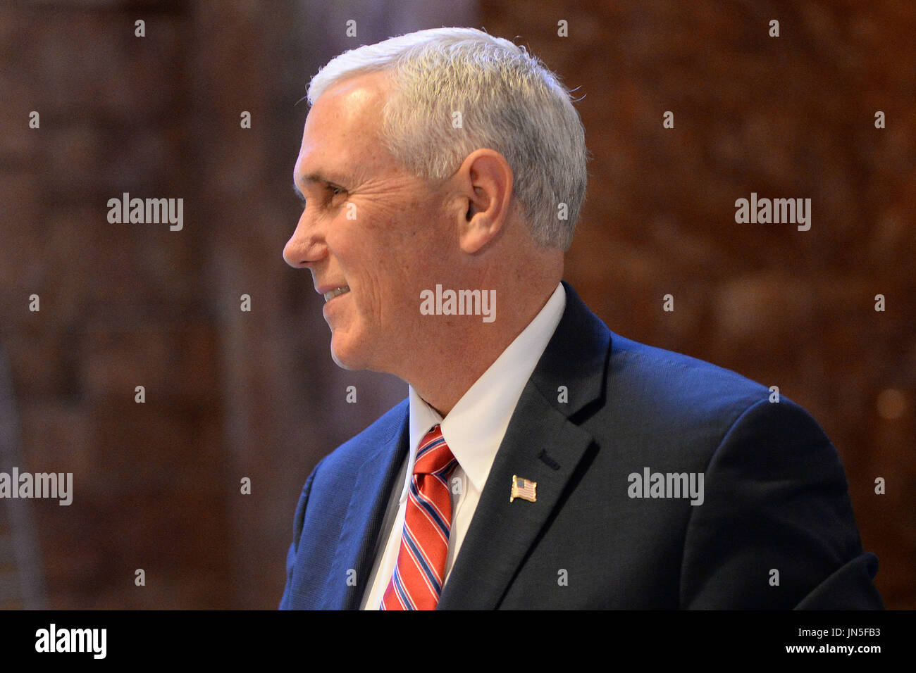 United States Vice President-elect Mike Pence walks through lobby of ...