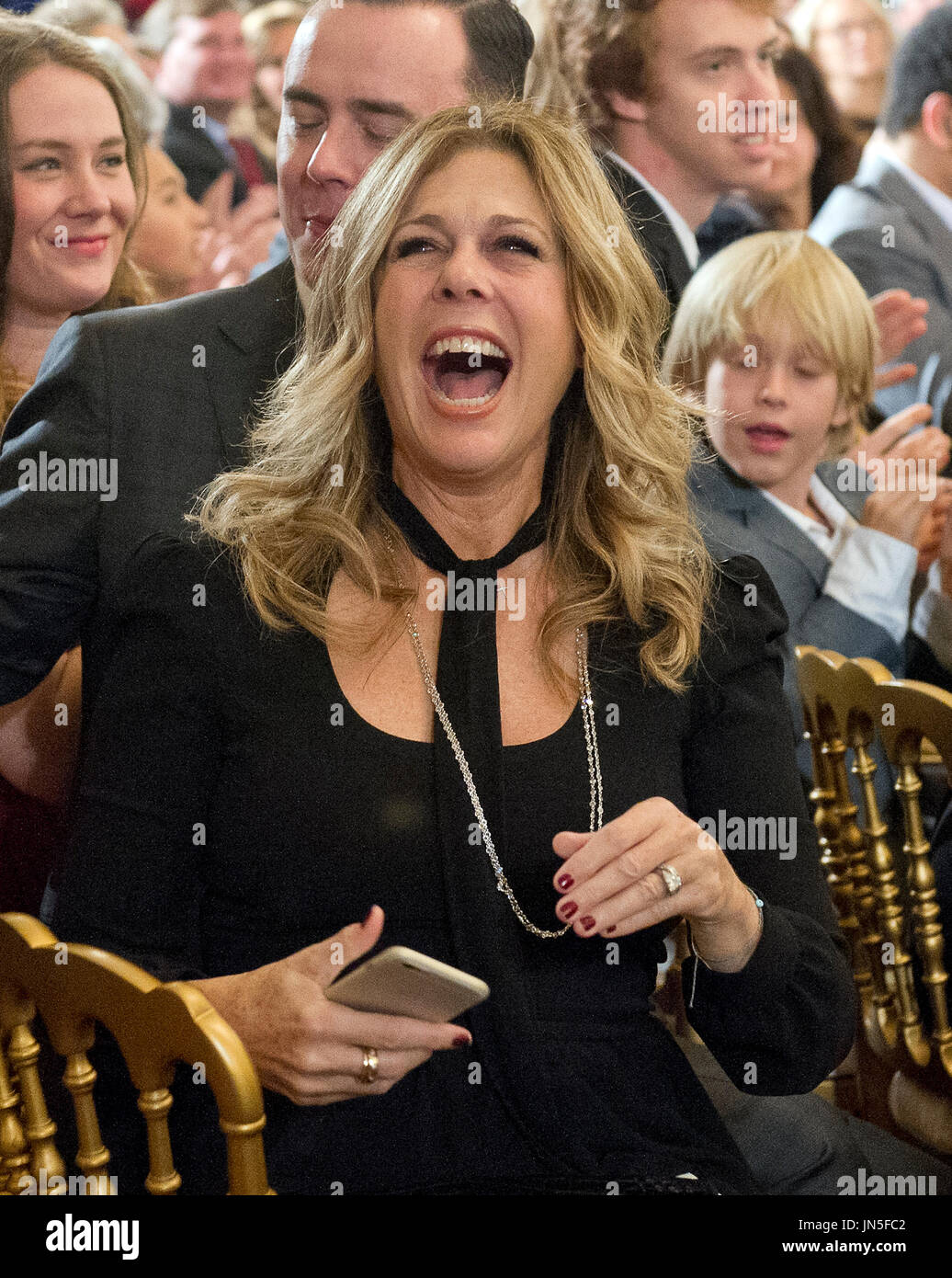 Actress Rita Wilson cheers as her husband, actor and filmmaker Tom ...