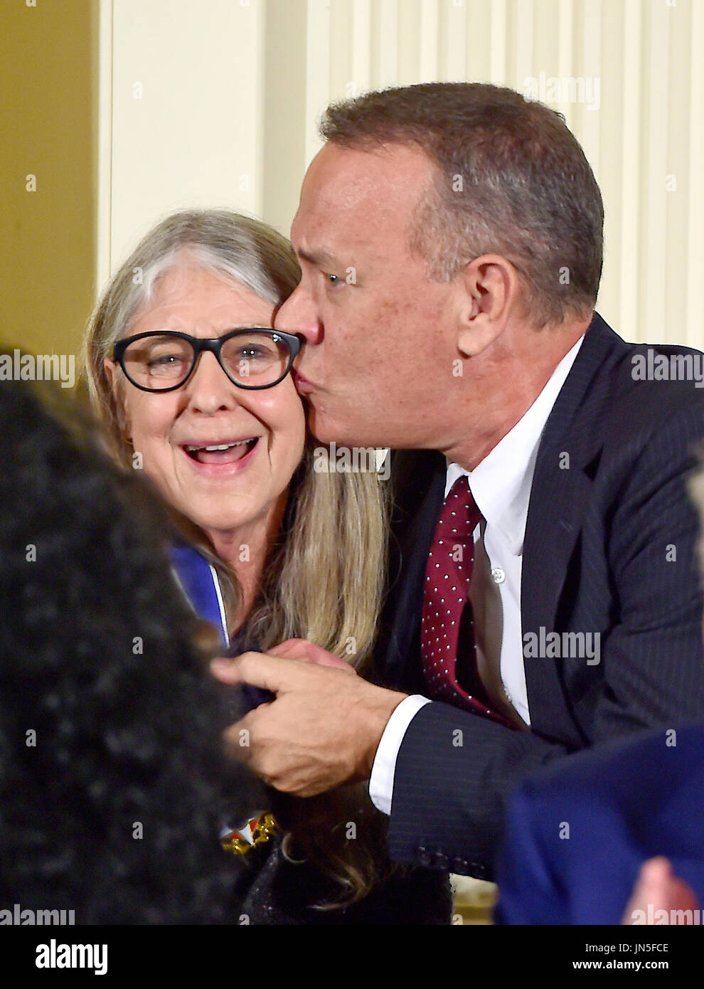 Tom Hanks kisses computer scientist Margaret H. Hamilton after she ...