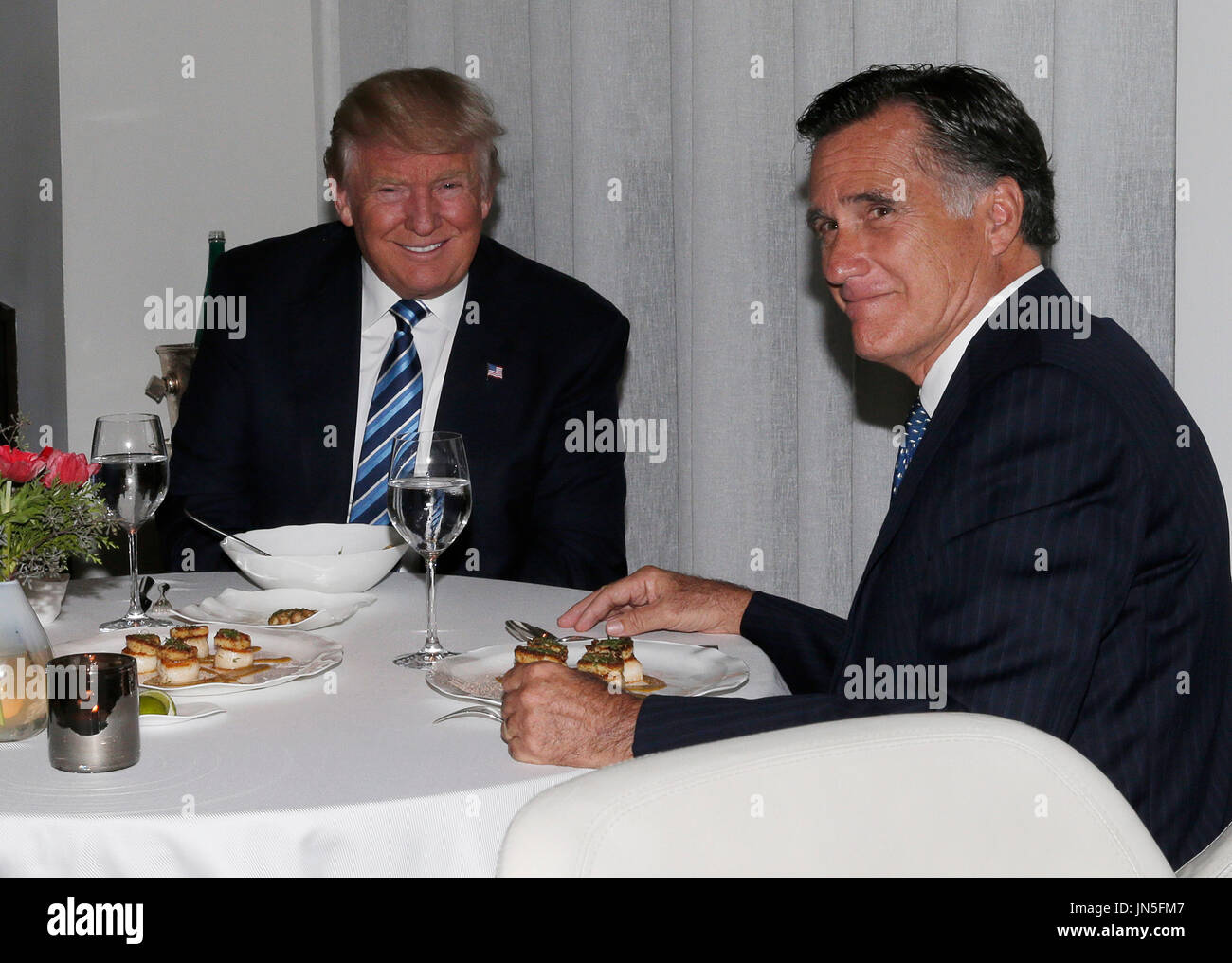 United States President-elect Donald Trump sits at a table with former ...