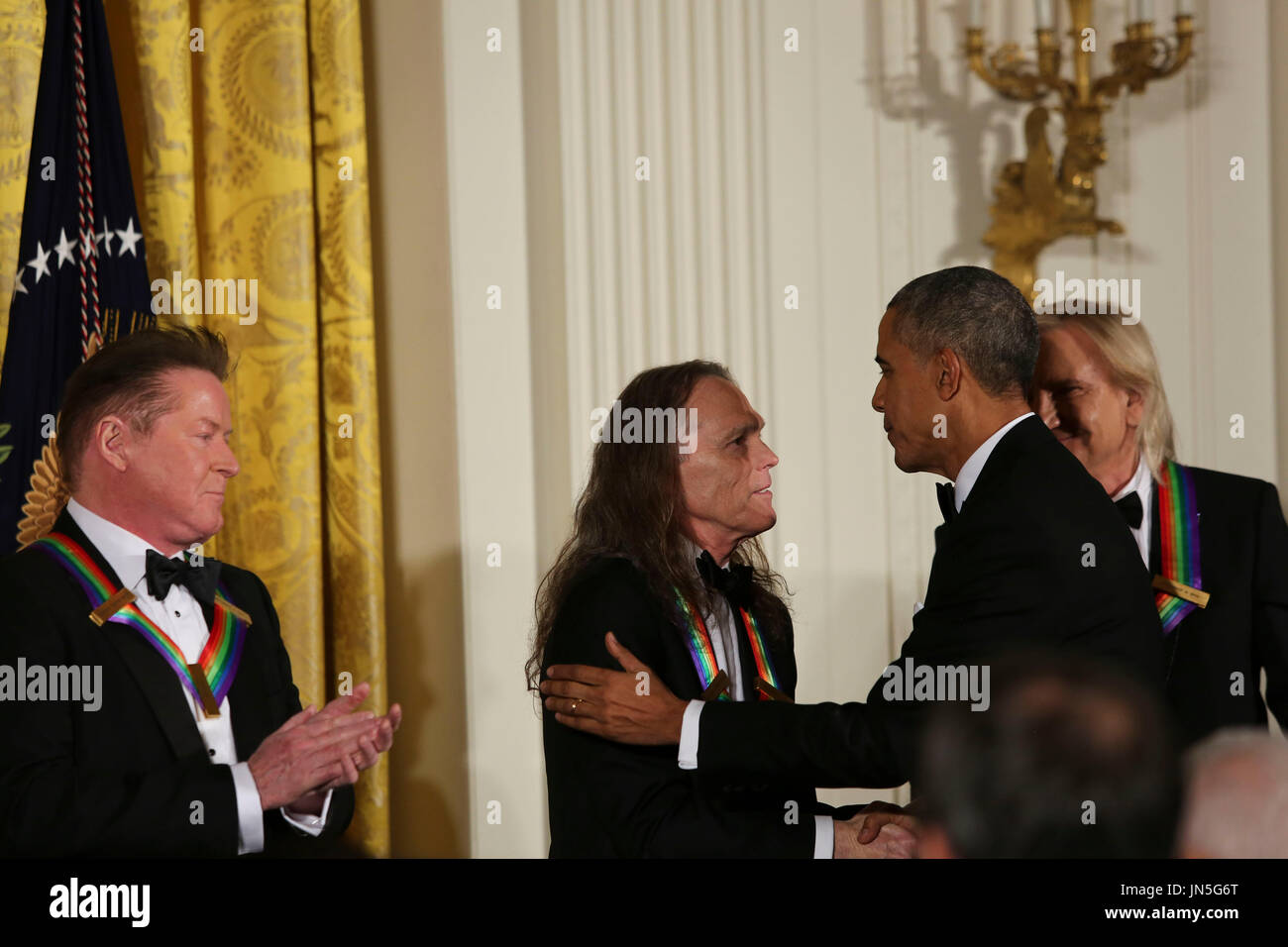 United States President Barack Obama shakes hands with Eagles band ...