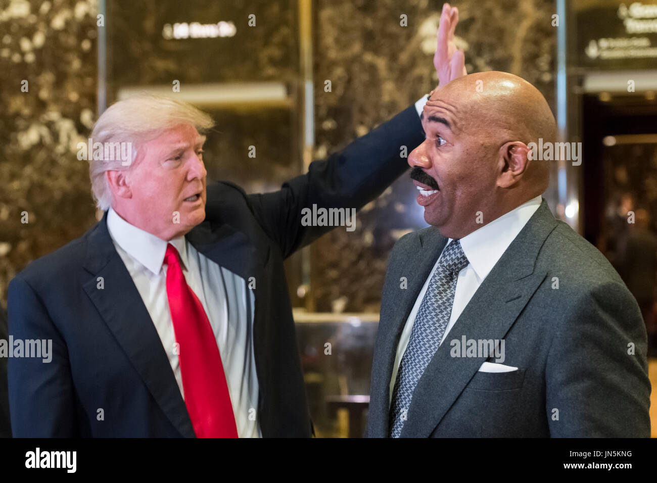 President-elect Donald Trump (L) and media host Steve Harvey (R) are ...