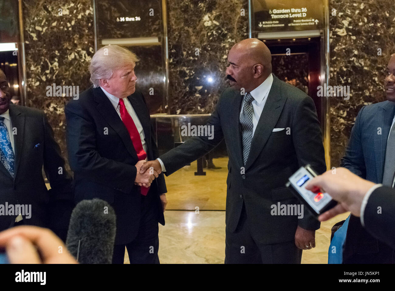 President-elect Donald Trump (L) and media host Steve Harvey (R) are ...