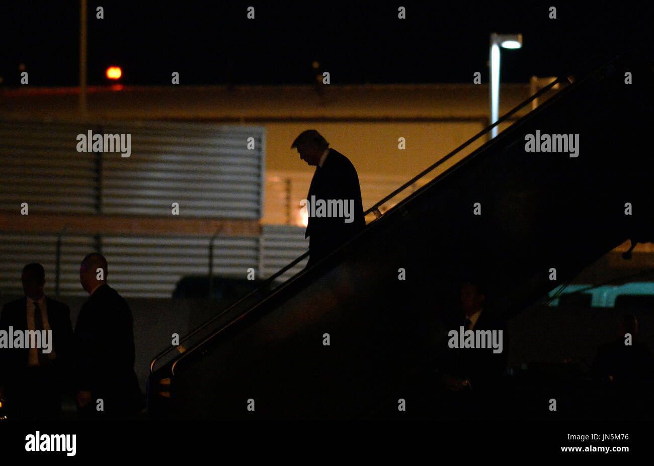 United States President-elect Donald Trump's walks out his plane at ...