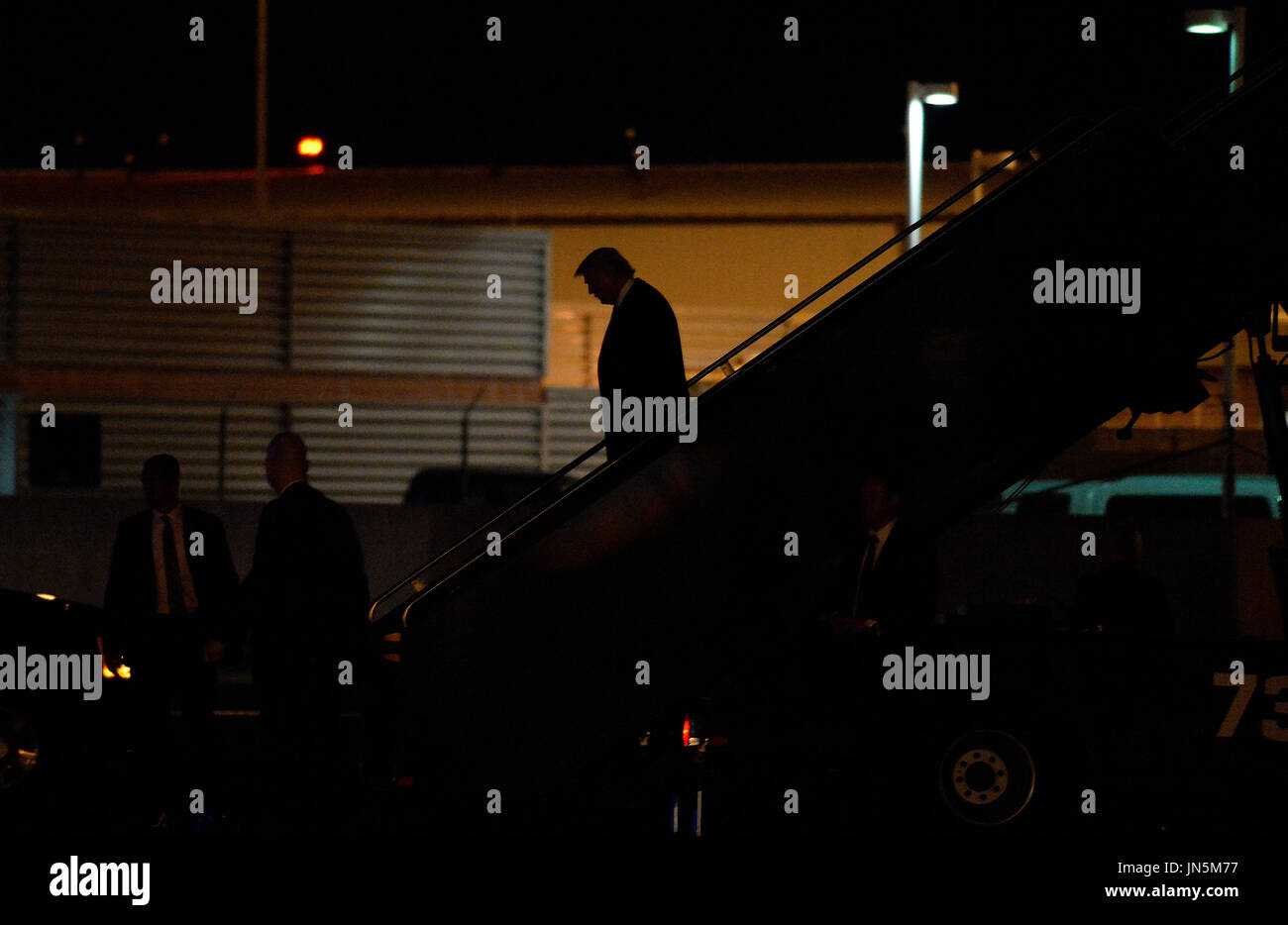United States President-elect Donald Trump's walks out his plane at ...