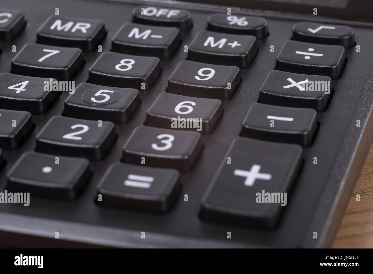 Close up of the symbols and numbers on a black calculator keypad Stock ...