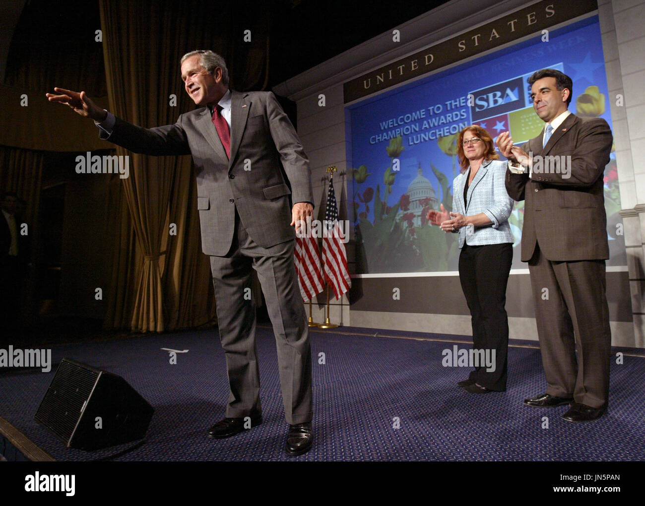 United States President George W. Bush (L) waves goodbye after speaking ...