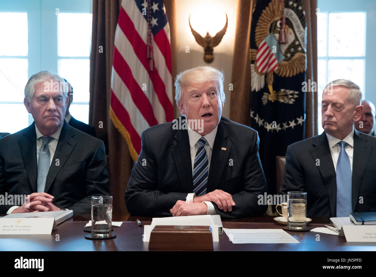 US President Donald J. Trump (C) holds a meeting with members of his ...