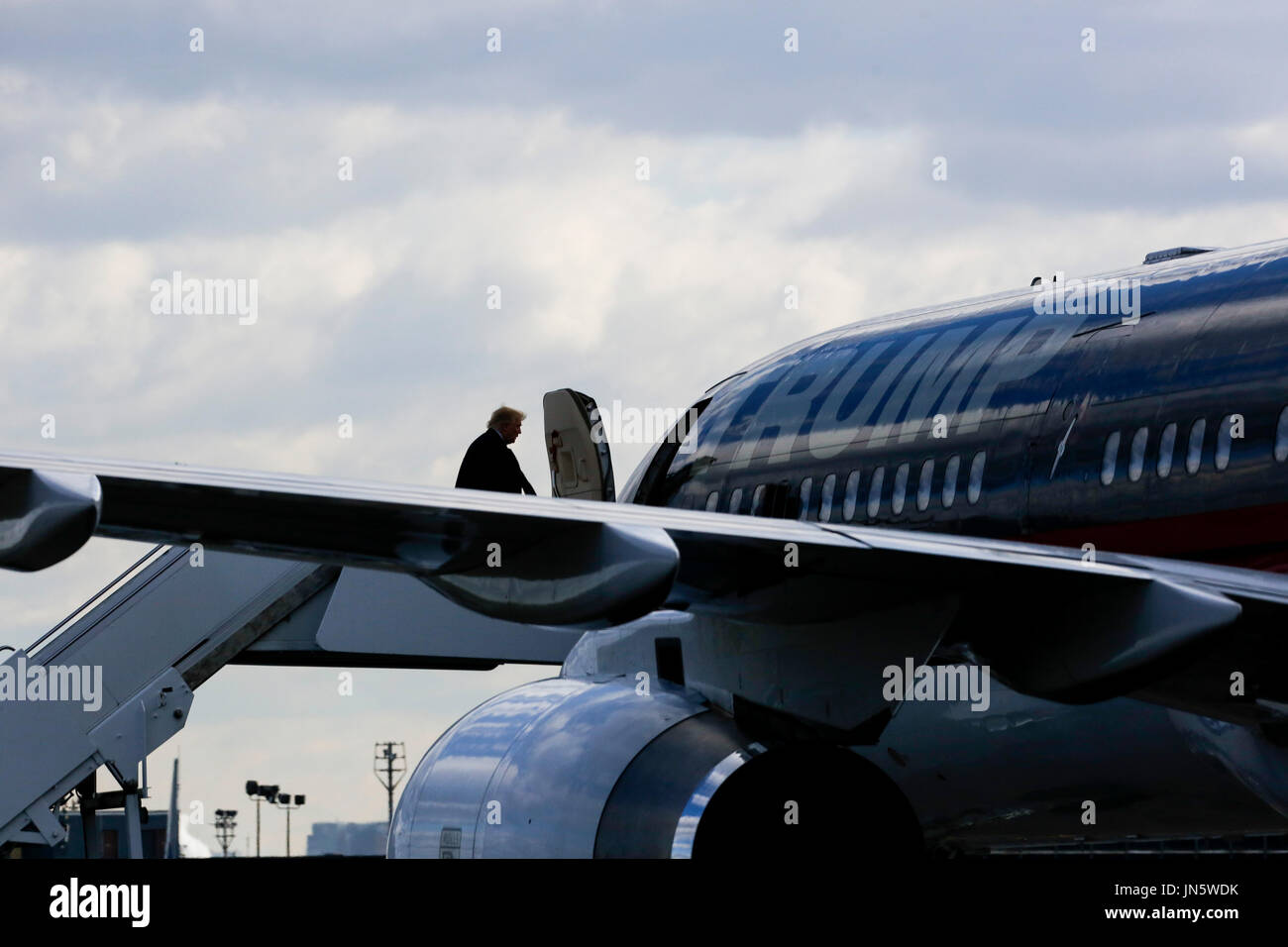 United States President-elect Donald Trump boards his plane at ...