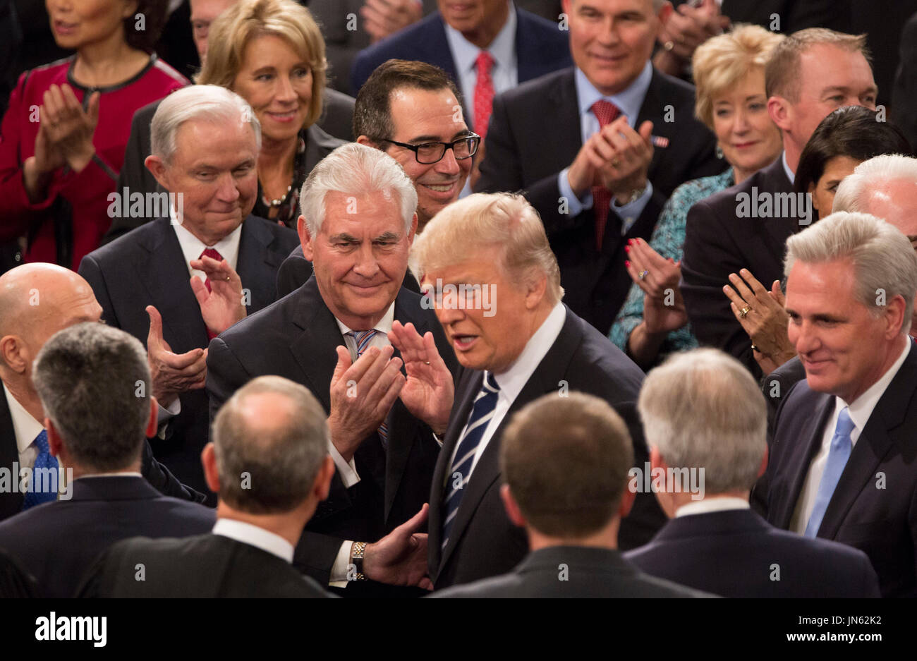 United States President Donald J. Trump is greeted by members of his ...