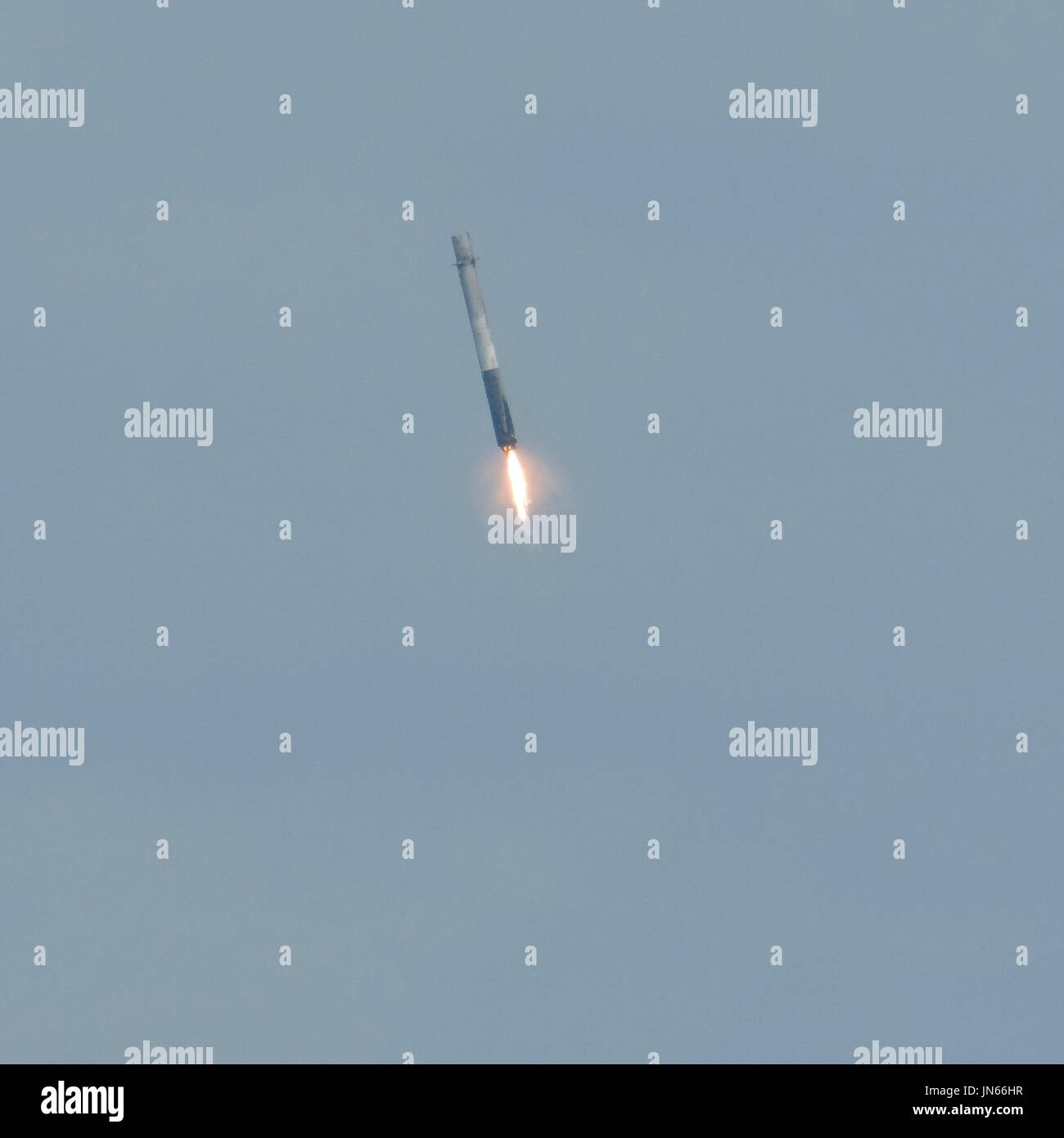 The SpaceX Falcon 9 first stage booster is seen as it lands shortly ...