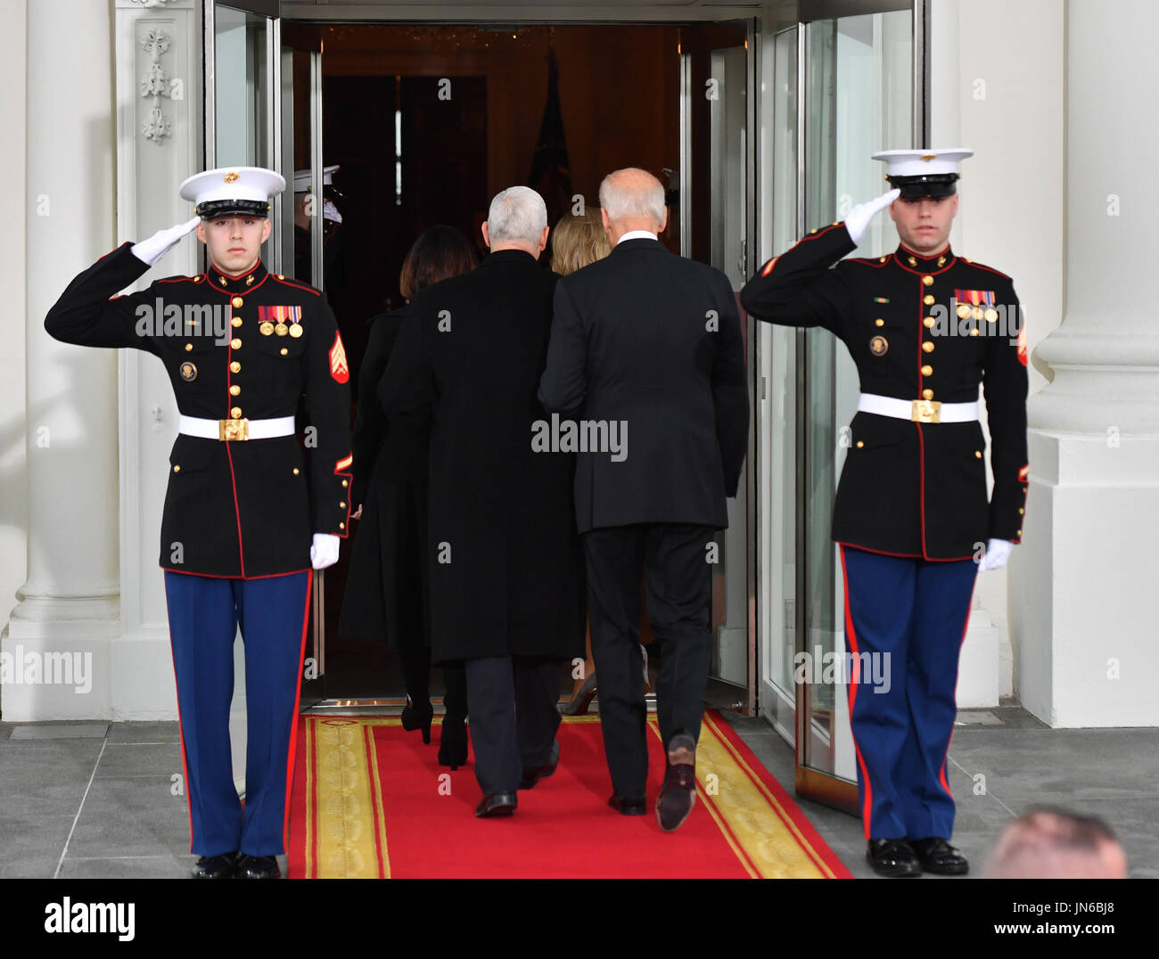 Vice President Joe Biden (R) escorts Vice President-elect Mike Pence ...