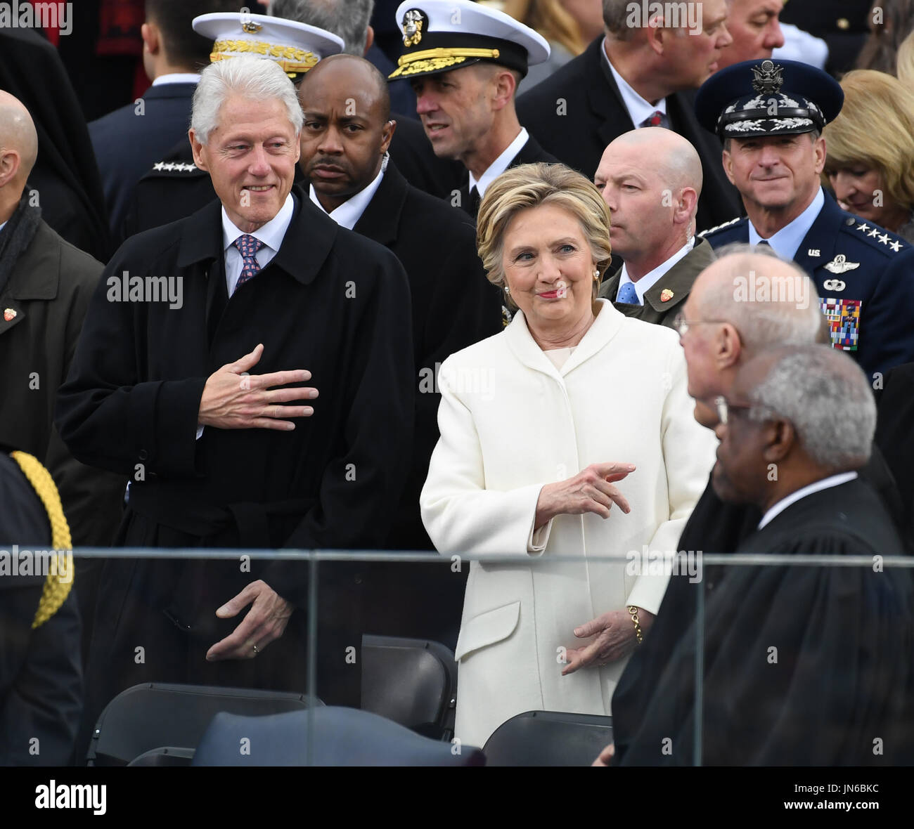 Former President Bill Clinton (L) and Hillary Clinton greet guests at ...