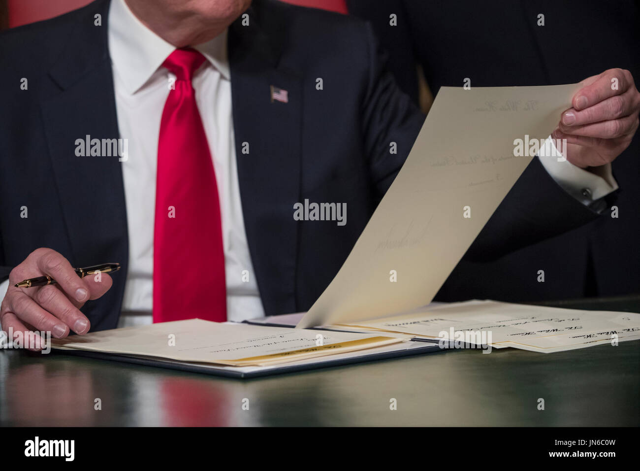 United States President Donald Trump formally signs his cabinet ...