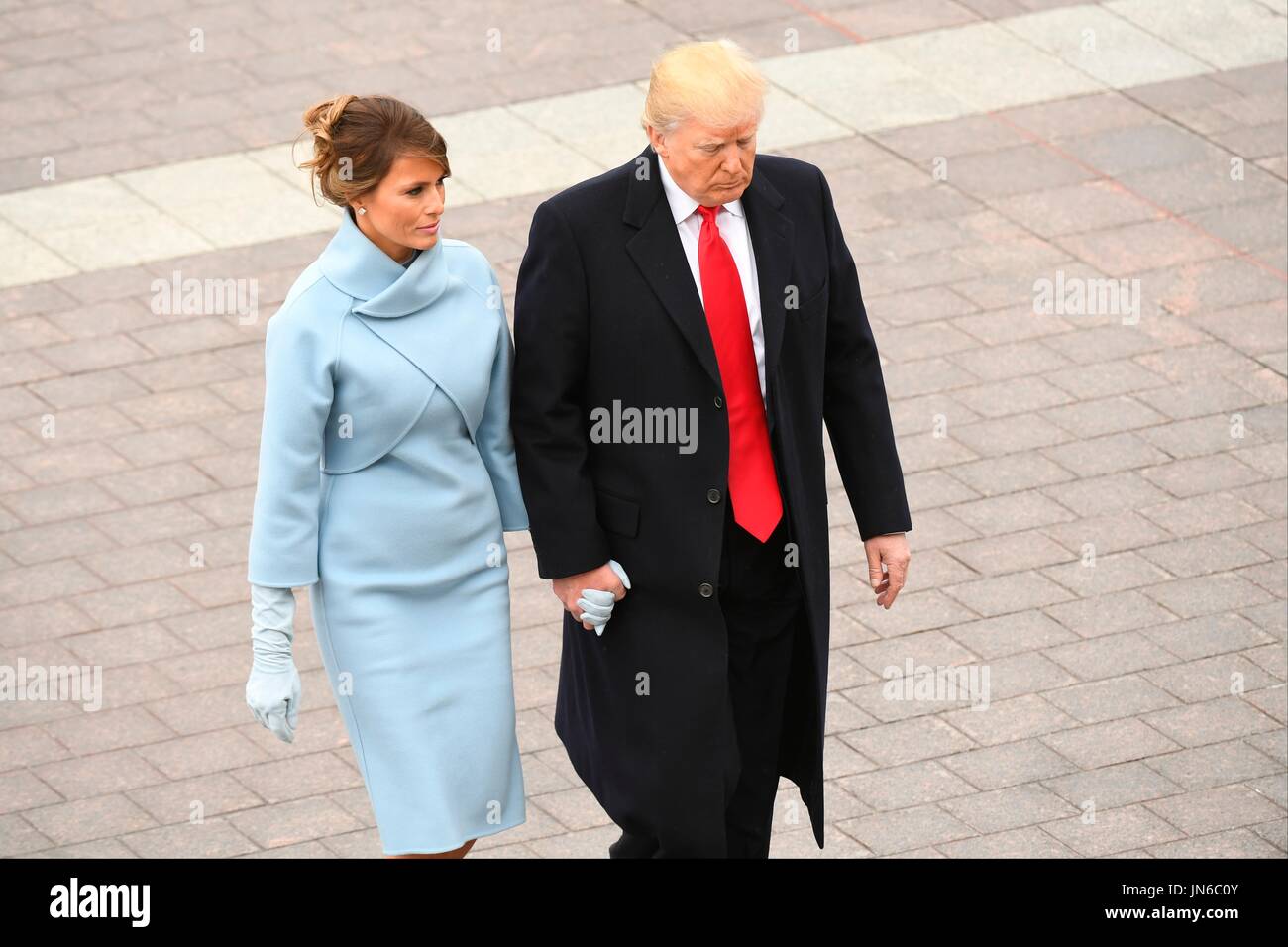 United States President Donald Trump and Melania Trump walk back after ...