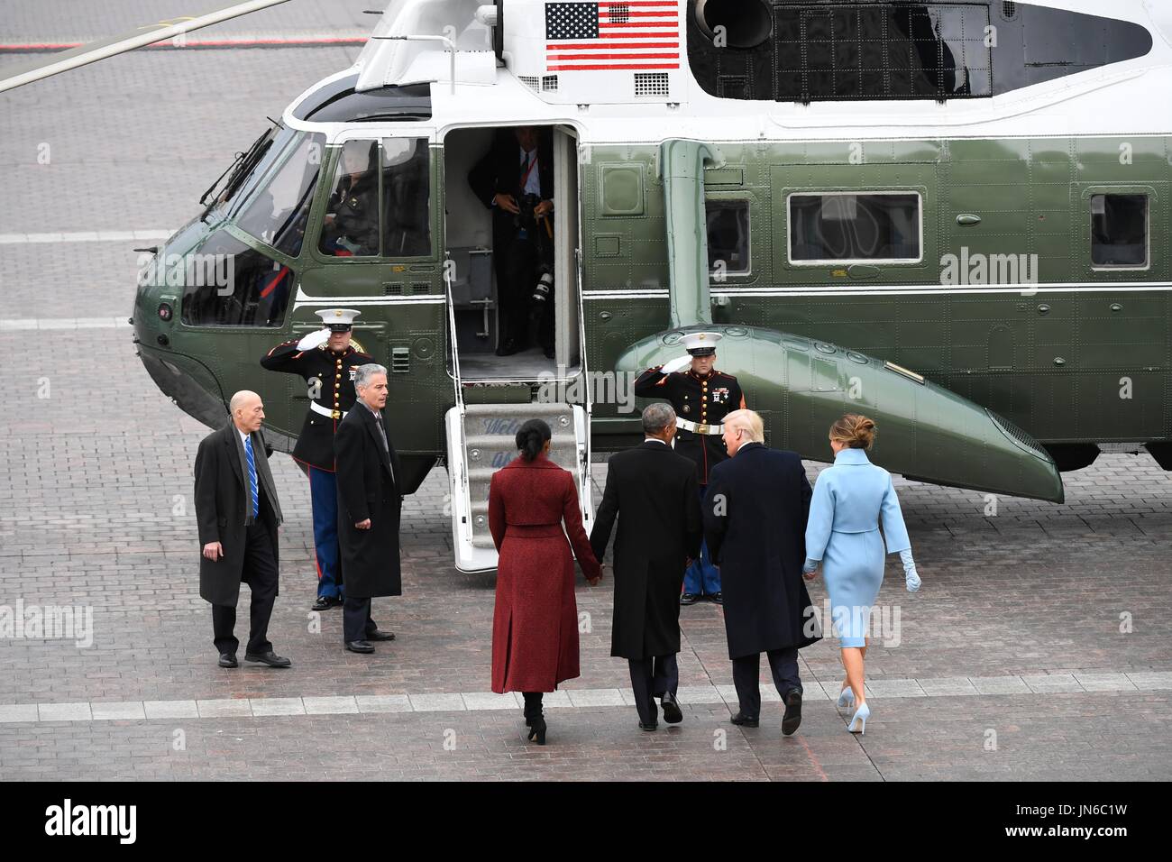 Former United States President Barack Obama and Michelle Obama stand ...