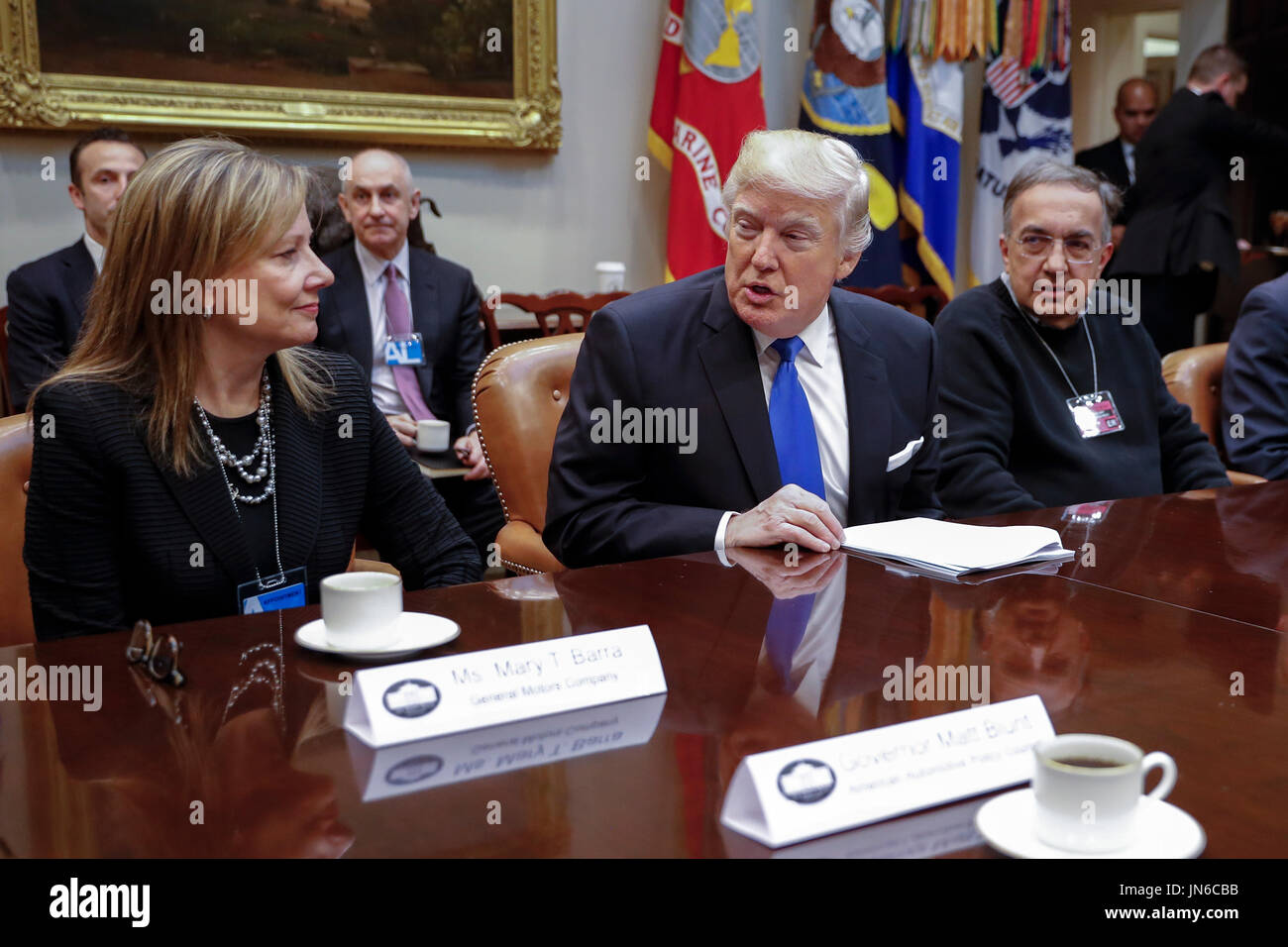 US President Donald Trump (C), with CEO of General Motors Mary Barra (L ...