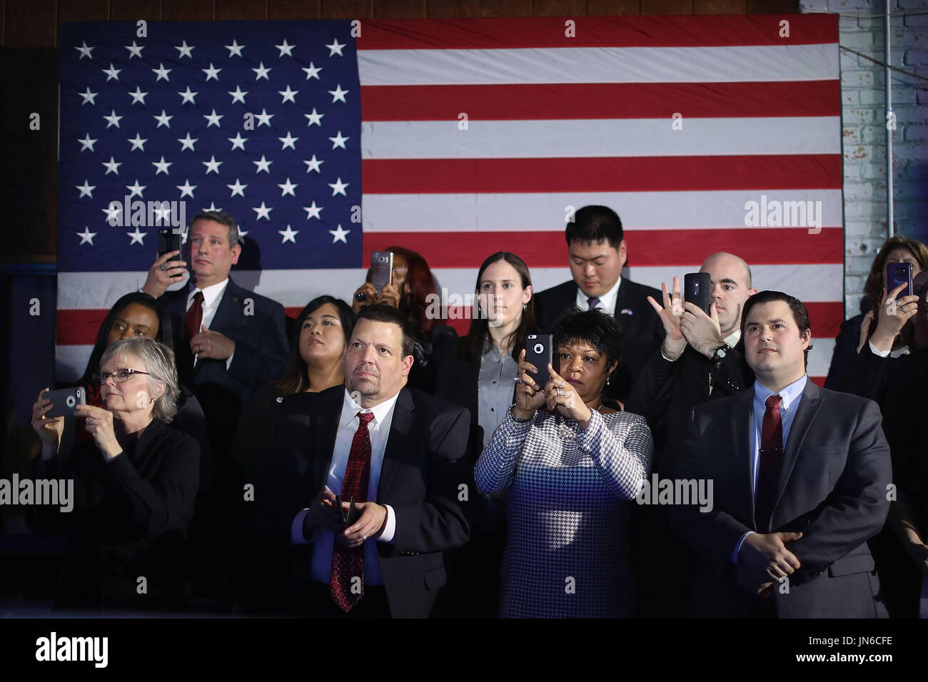 Department of Homeland Security employees make photographs while ...