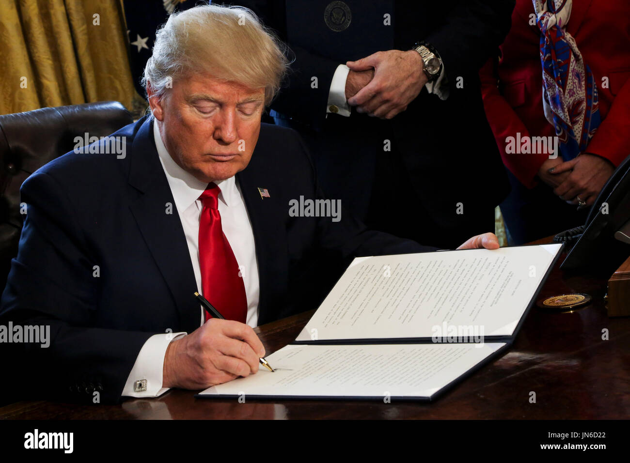 United States President Donald Trump signs an Executive Order in the ...