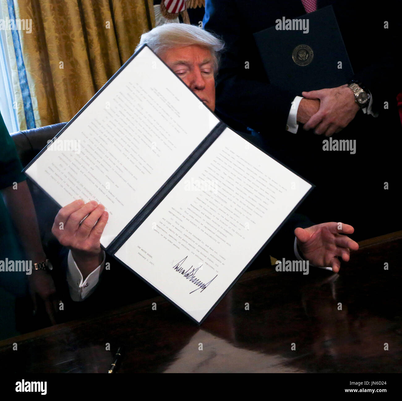 United States President Donald Trump signs an Executive Order in the ...
