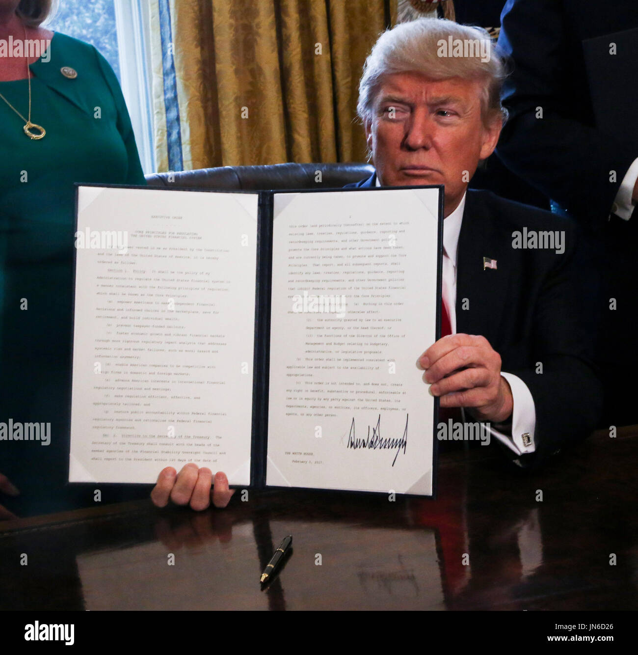United States President Donald Trump signs an Executive Order in the ...