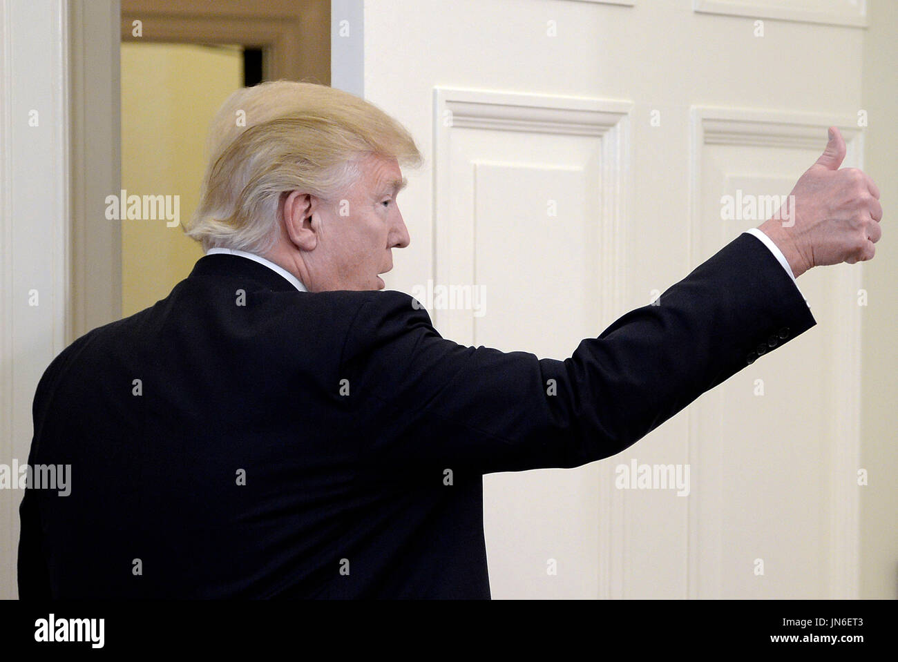 United States President Donald Trump gives a thumbs up after speaking ...