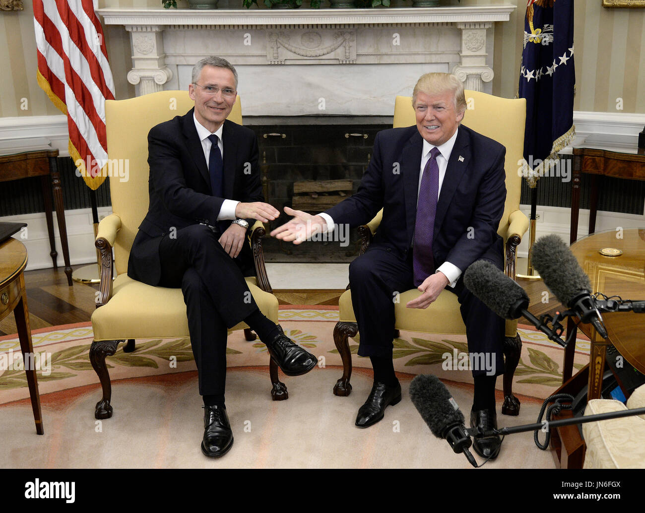 United States President Donald J. Trump shakes hands with Secretary ...