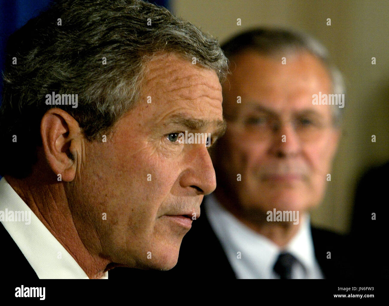 United States President George W. Bush, left, speaks as United States ...