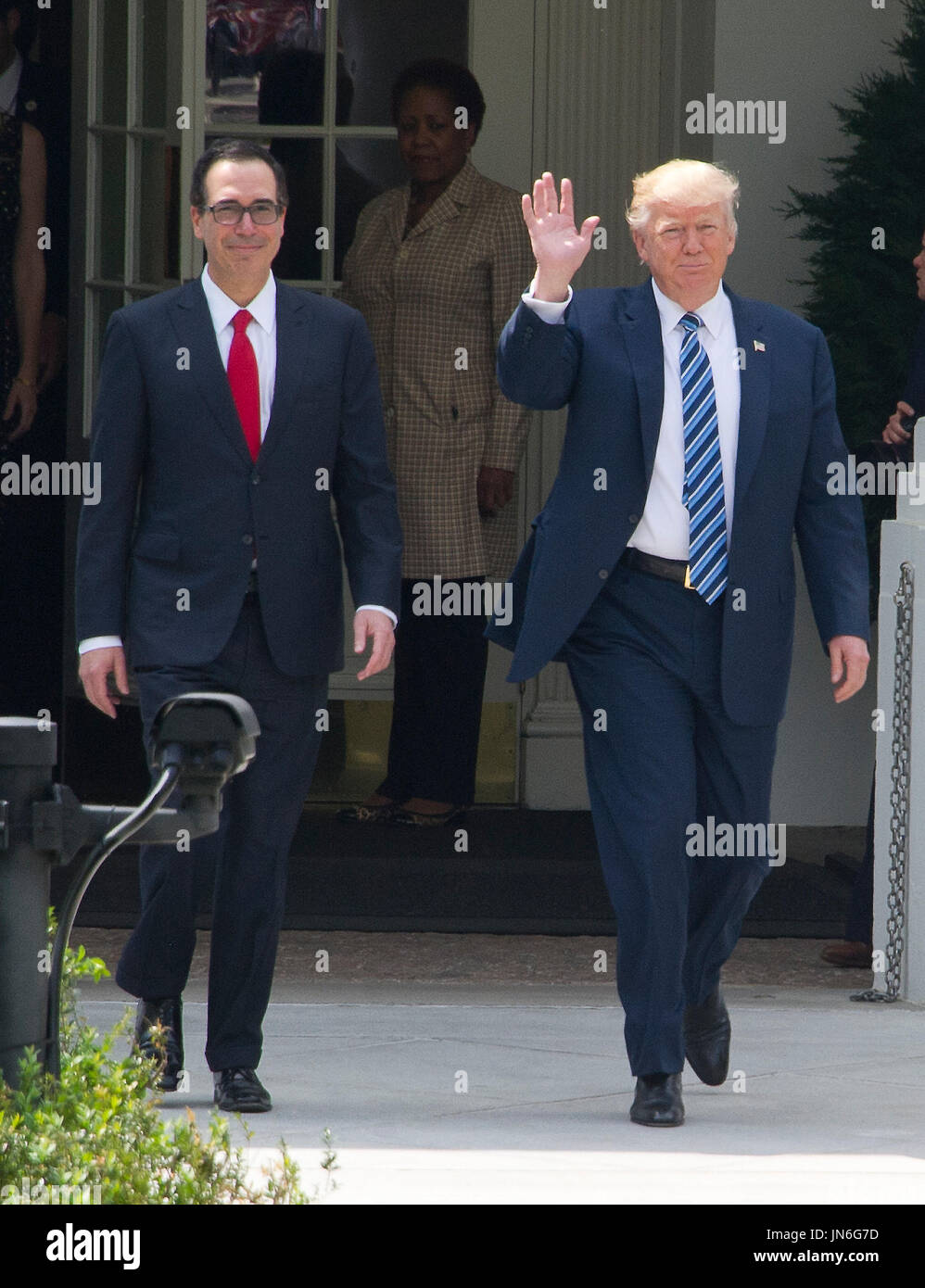 United States President Donald J. Trump waves to US Treasury employees ...