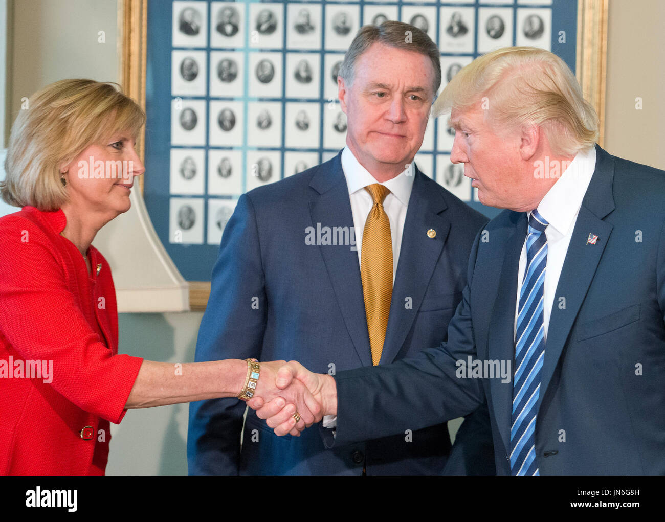 United States President Donald J. Trump, right, shakes hands with US ...