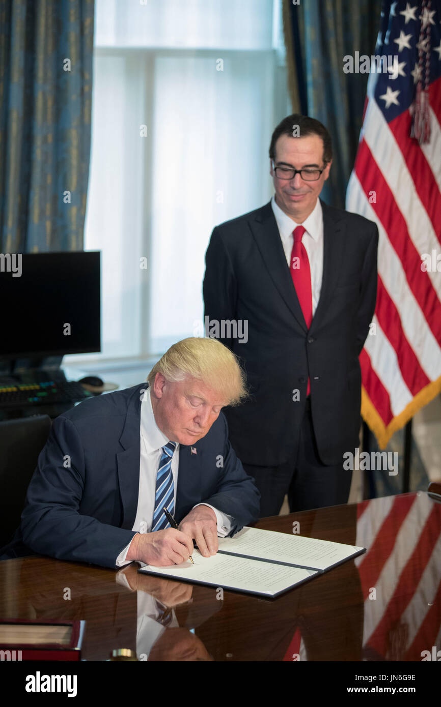 US President Donald J. Trump (L), with Secretary of Treasury Steven ...