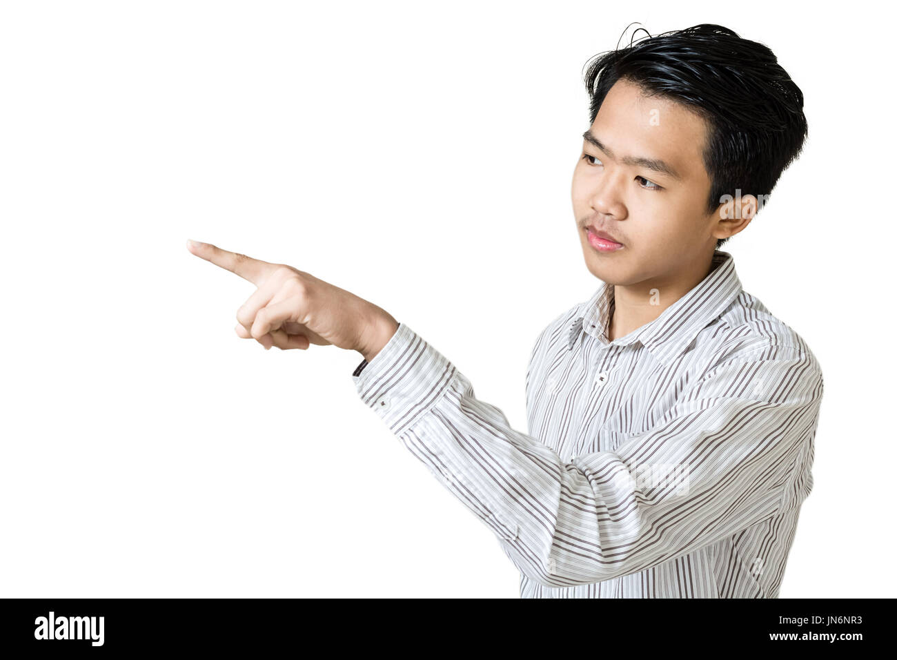 Young man pointing aside Cut Out Stock Images & Pictures - Alamy