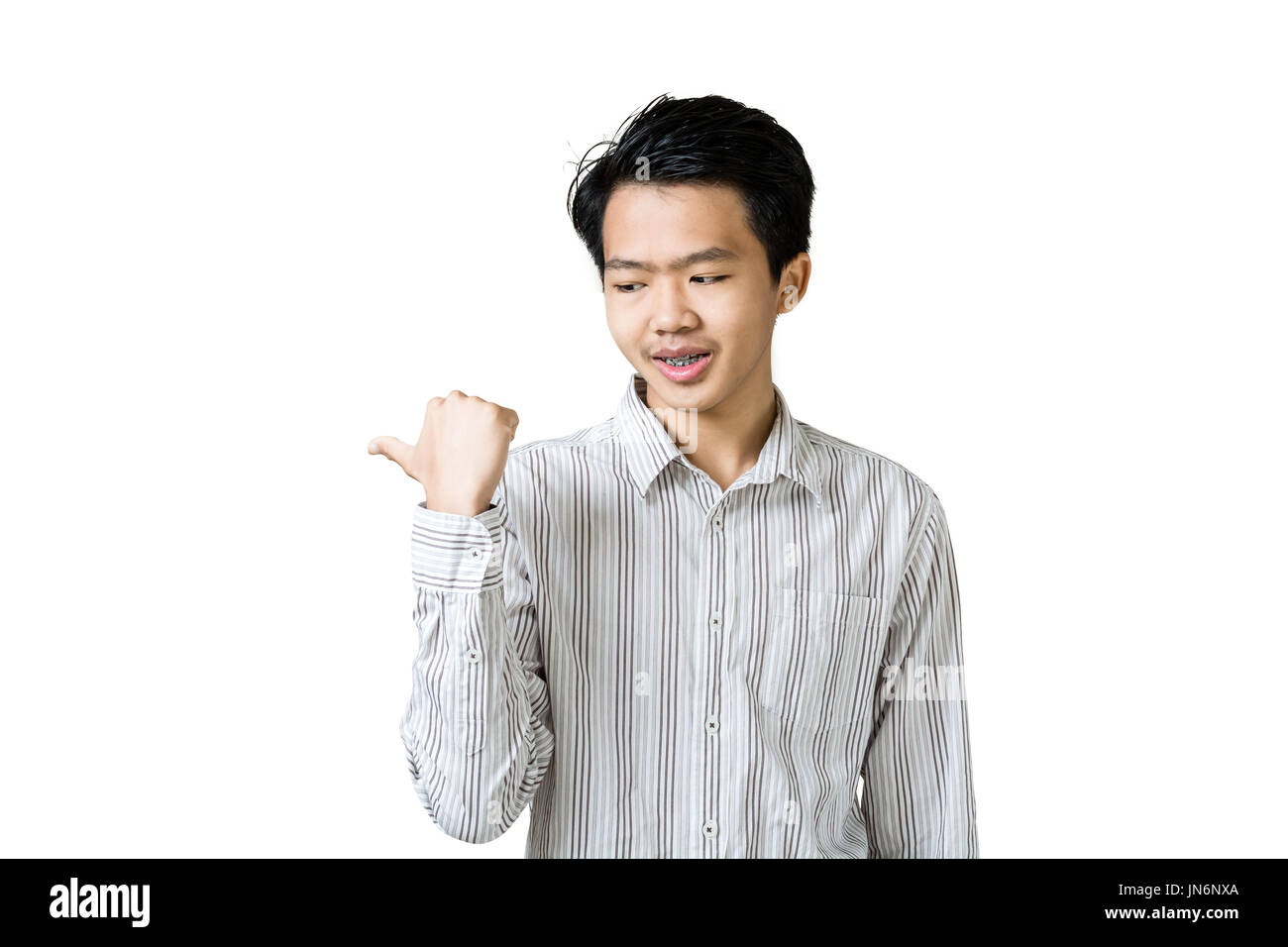 Portrait of a young businessman pointed his hand to left side. Isolated ...
