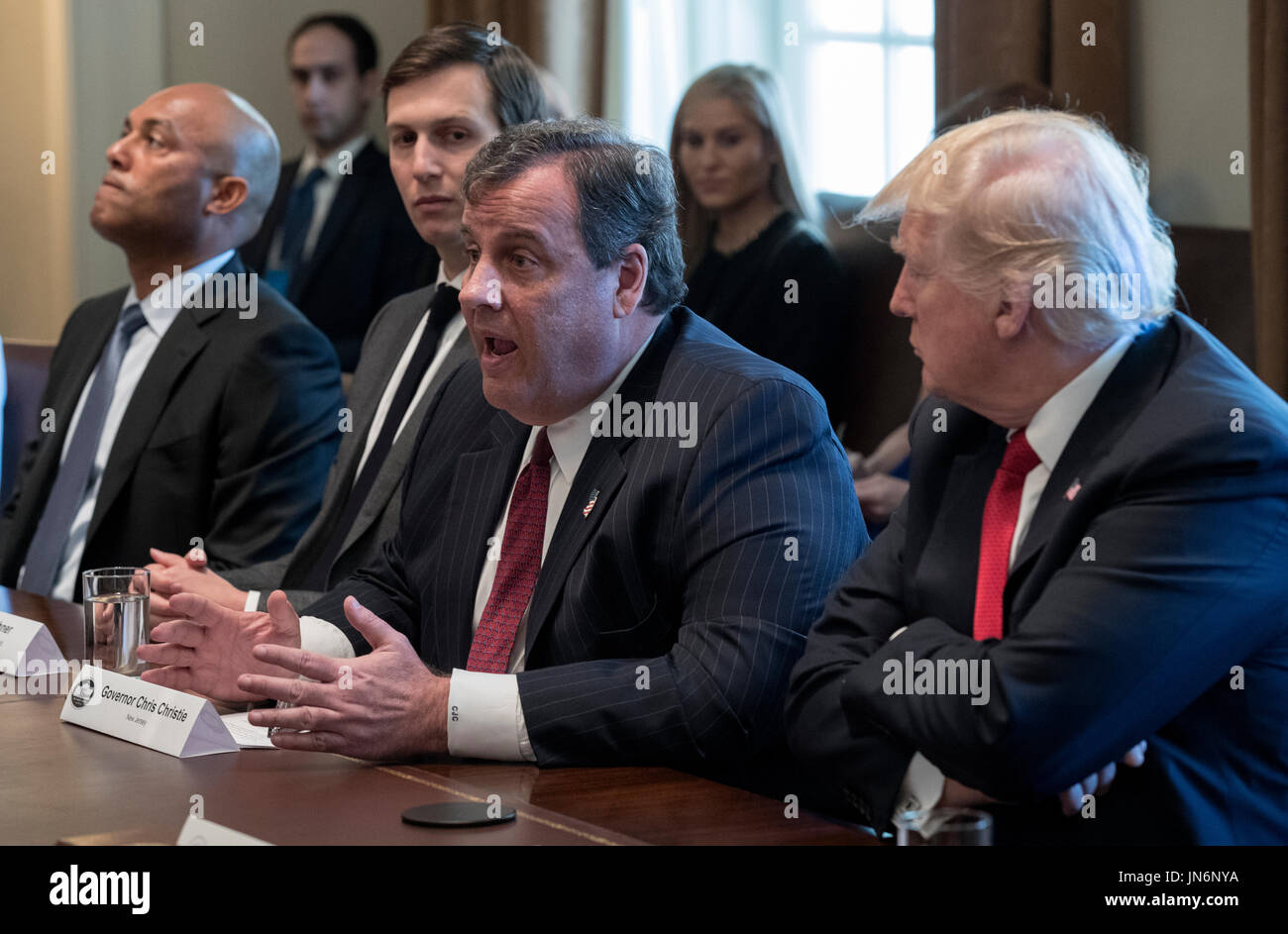 US President Donald J. Trump (R) listens as New Jersey Governor Chris ...