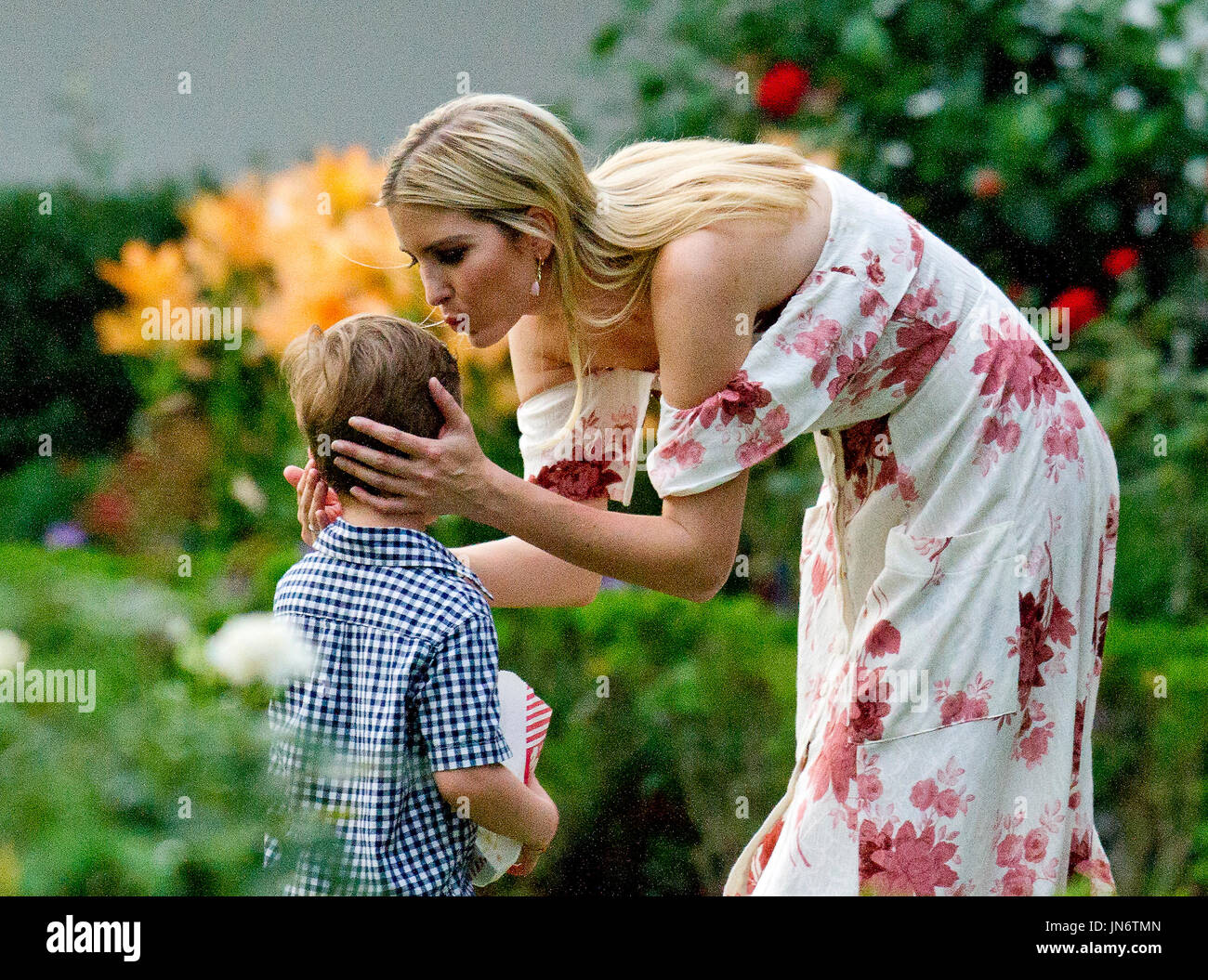 Assistant to the President Ivanka Trump kisses one of her sons in the ...