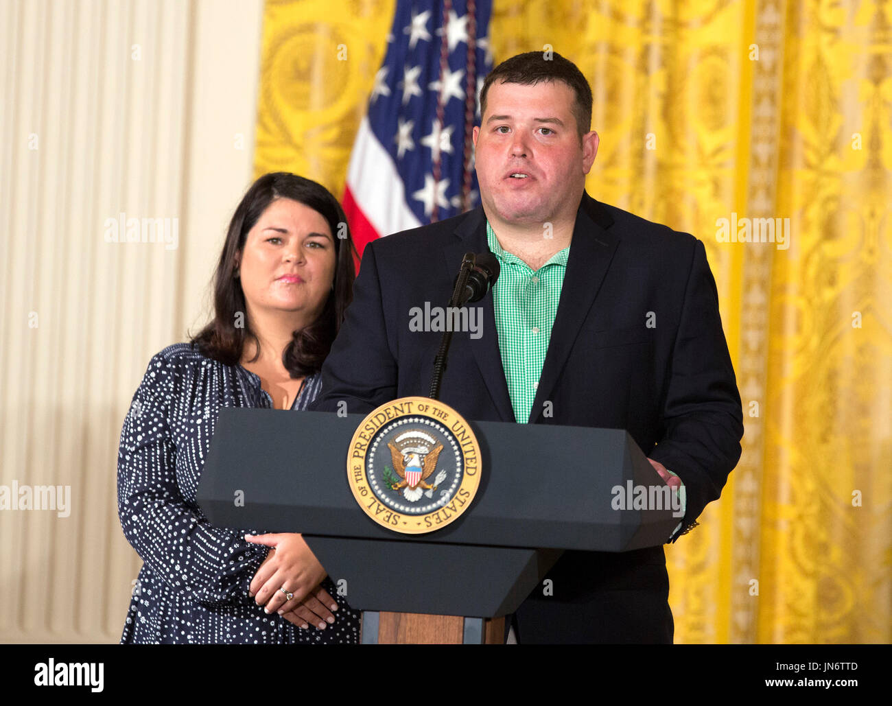 Sergeant Michael Verardo (right) speaks with his wife Sarah Verardo at ...