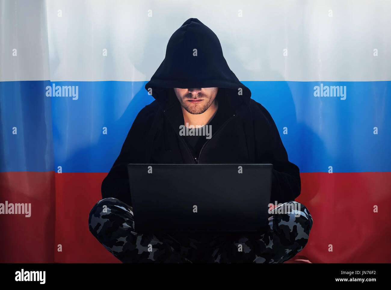 Hacker sitting computer cracking hi-res stock photography and images ...