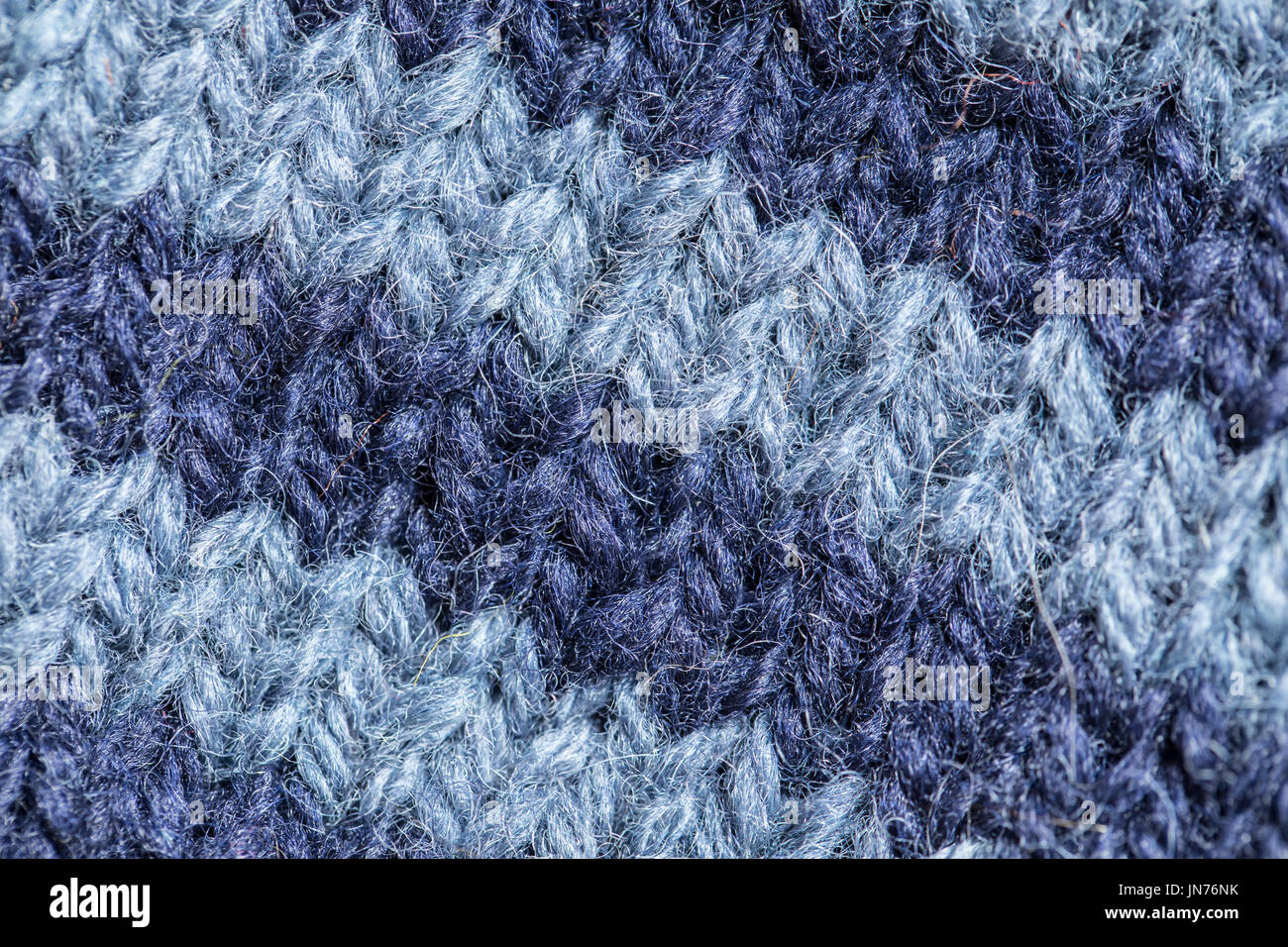 A beautiful closeup of a hand knitted warm and soft wool pattern. Soft ...