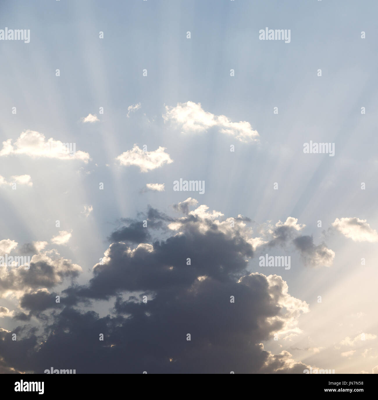 in the empty sky lots of clouds and sunny ray of light Stock Photo - Alamy