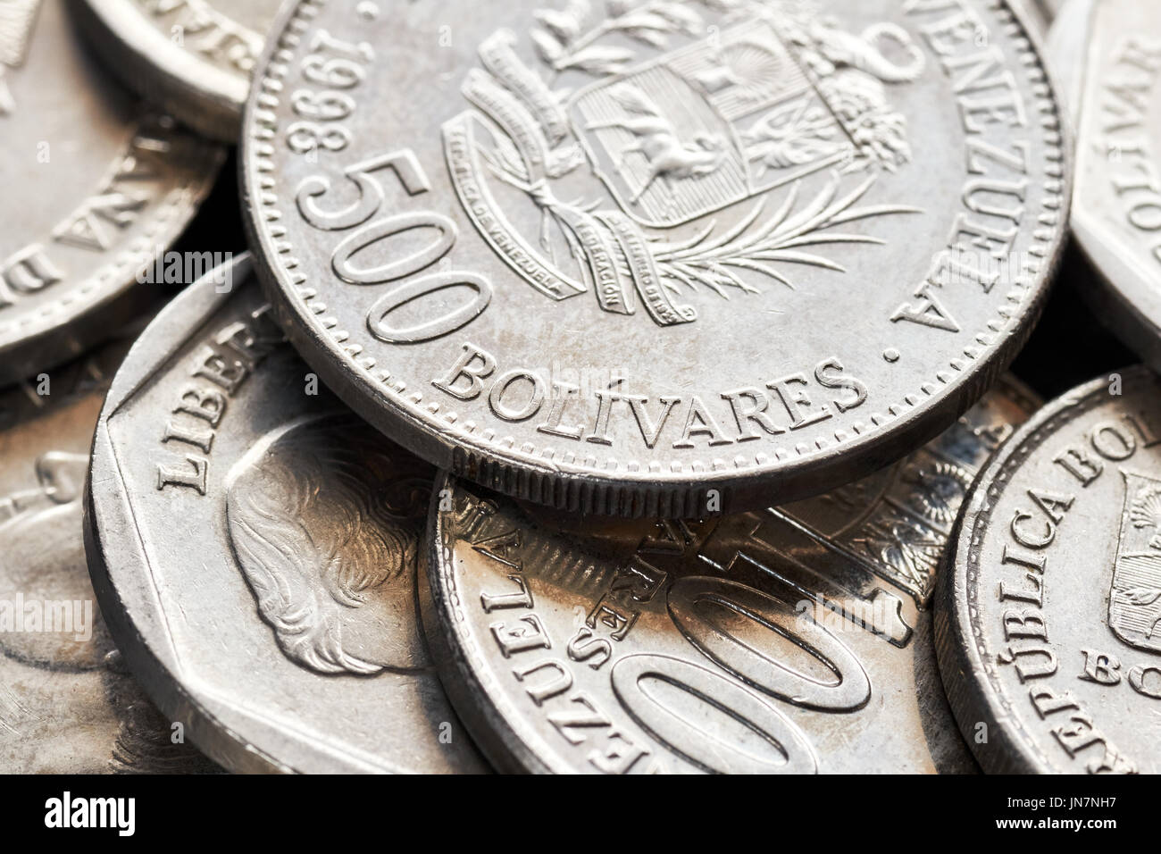 Extreme close up picture of old Venezuelan bolivar coins, shallow depth ...
