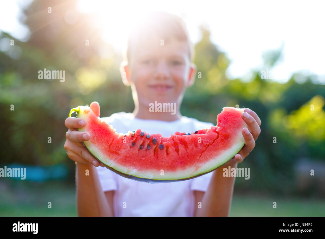 Cute little kid eating watermelon hi-res stock photography and images ...