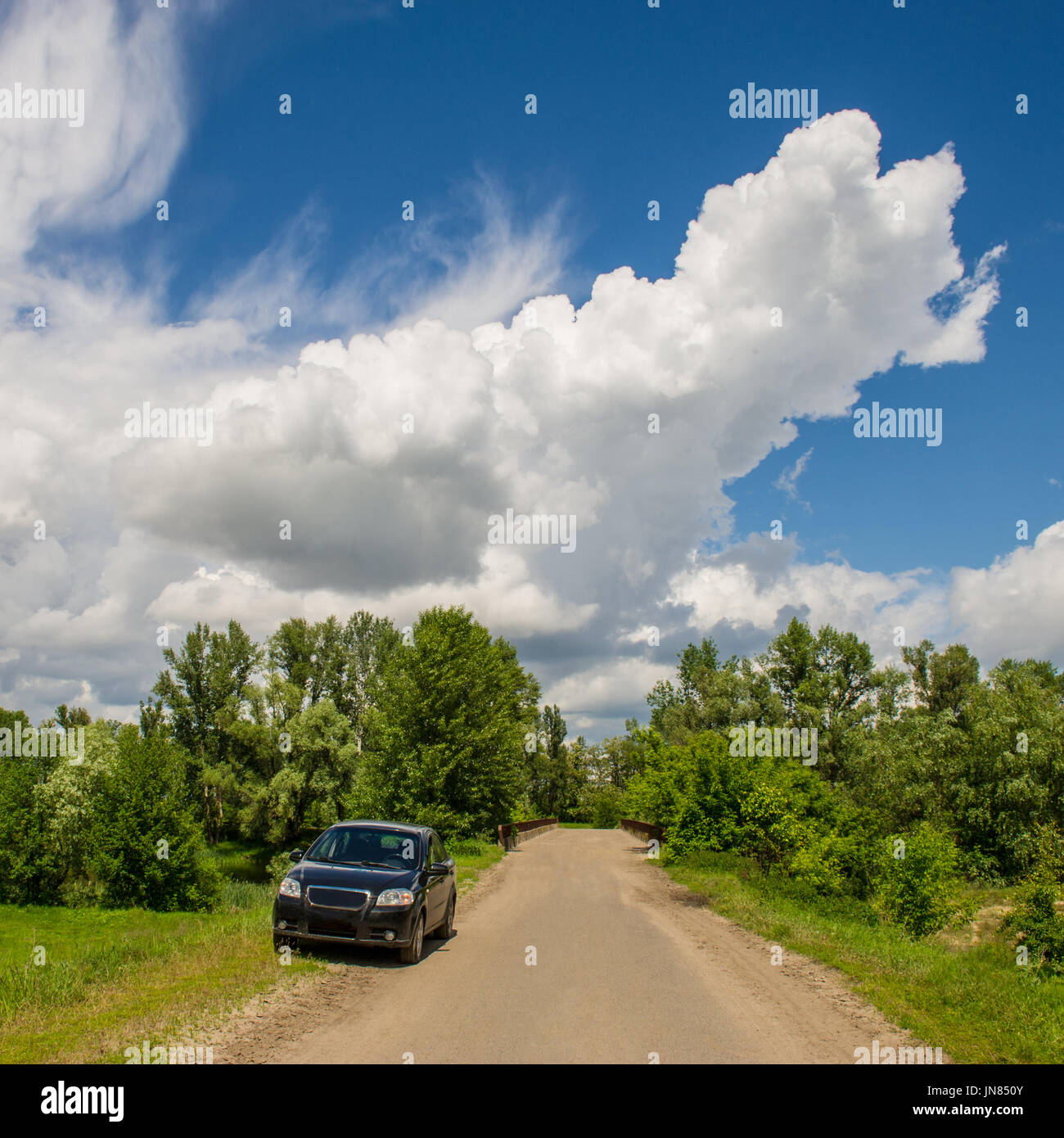 Rural landscape with a car at the side of the road Stock Photo - Alamy