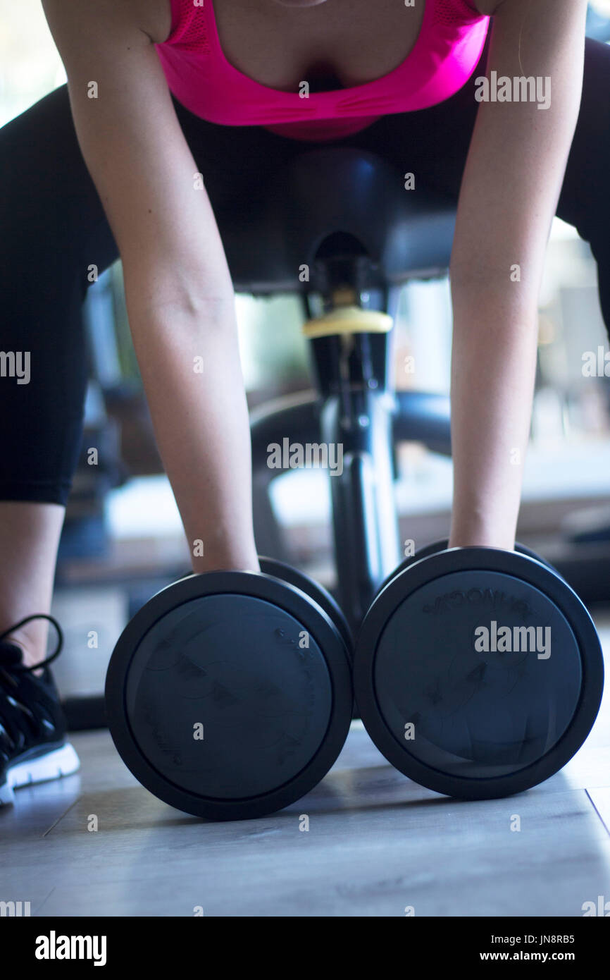 Woman working out female exercise fitness sports weights training in ...