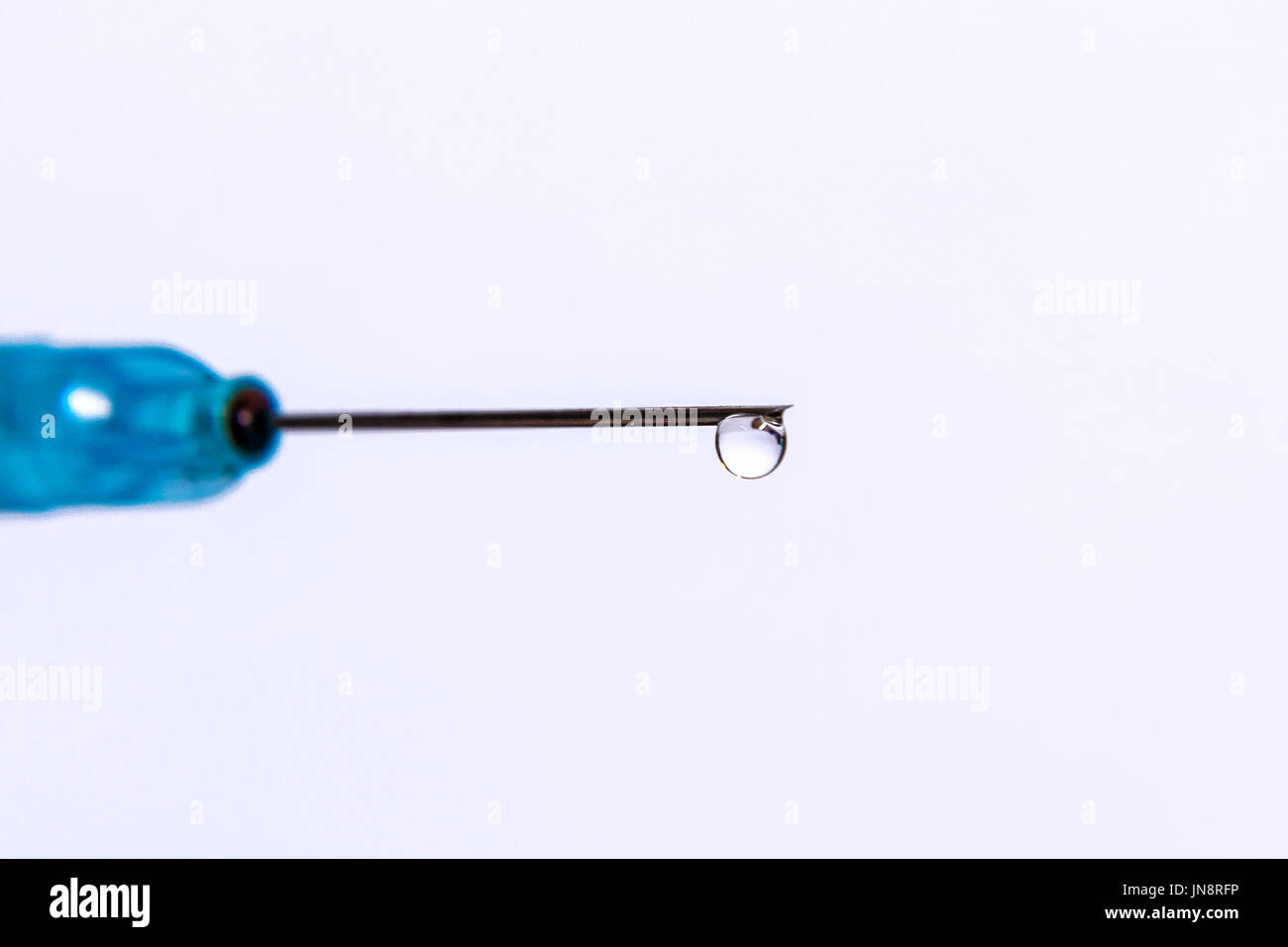 Syringe needle drop serum on hi-res stock photography and images - Alamy