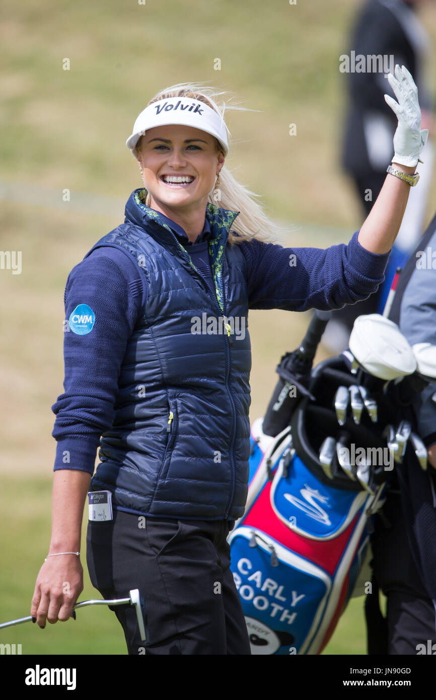 Scotland's Carly Booth is all smiles as he makes her way to the green ...