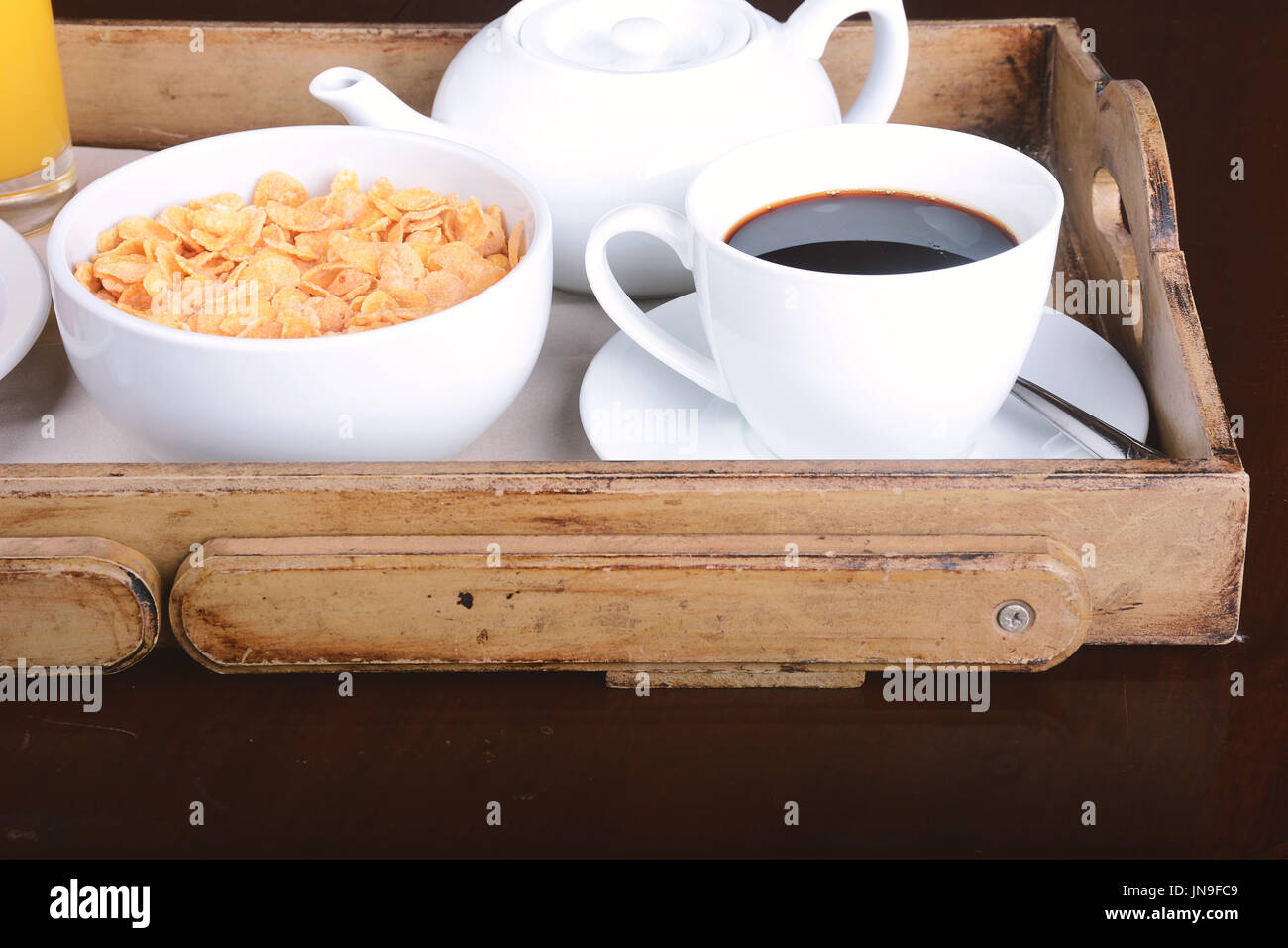 Breakfast tray with coffee, orange juice and bowl of cereals Stock ...